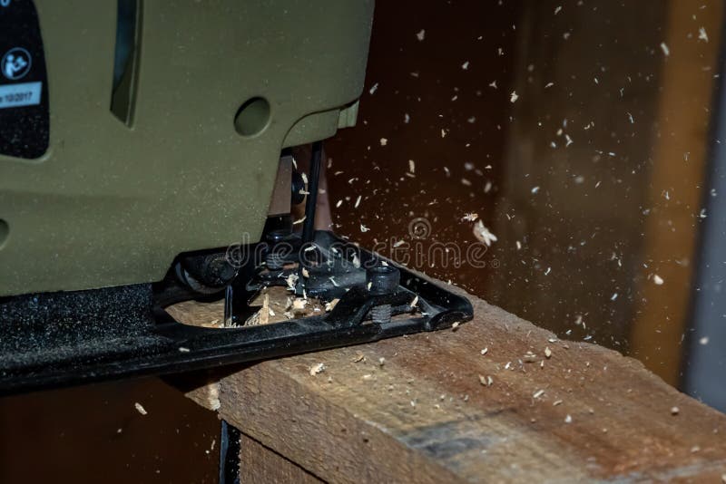 Jigsaw is Cutting Timber with Wood Chips Stock Photo - Image of wheel ...