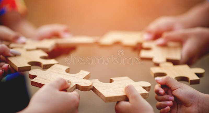 Jigsaw in Hand Puzzle Pieces Gather Together Teamwork the Concept of ...