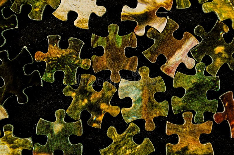 A Jigsaw Puzzle with Pieces of Different Colors and Sizes Stock Image ...