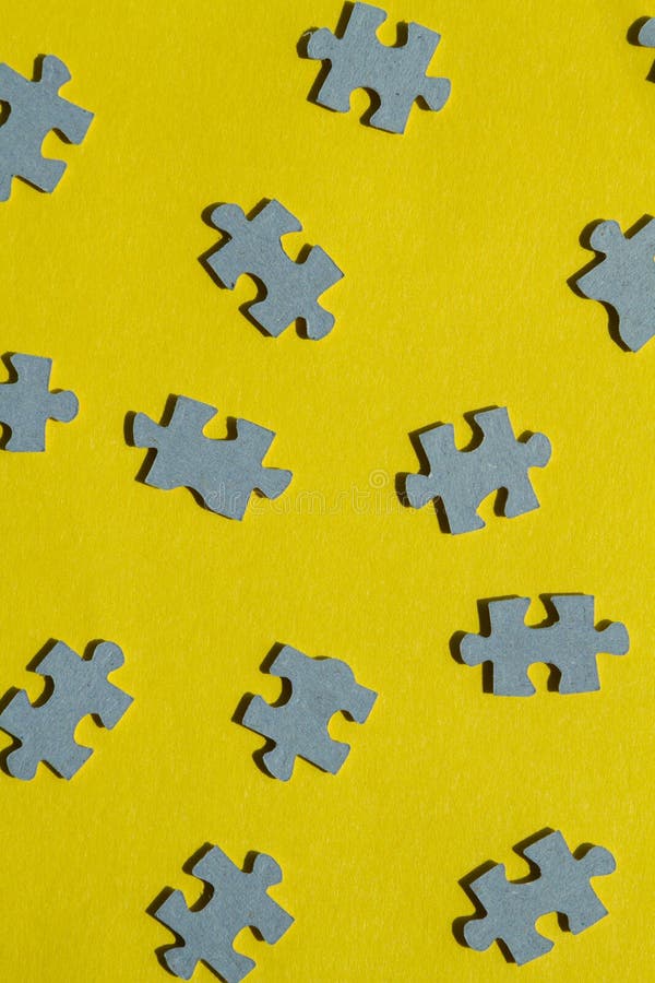 Jigsaw Puzzle Pieces on Yellow Background Stock Image - Image of macro ...