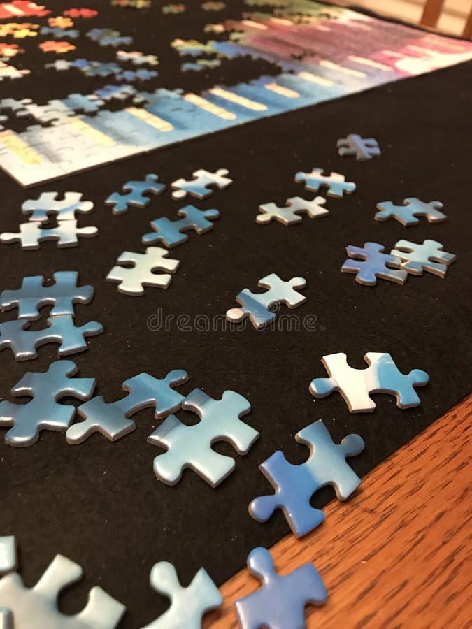 Jigsaw puzzle in progress stock image. Image of gametime - 150317307