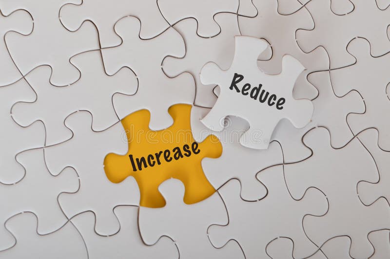Jigsaw Puzzles with Text REDUCE and INCREASE Isolated on a Yellow ...