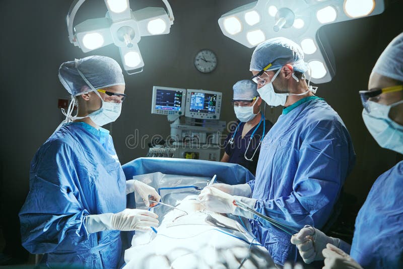 This Job is Life or Death. Surgeons in an Operating Room. Stock Photo ...