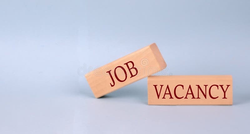 JOB VACANCY Text on the Wooden Block, Blue Background Stock Photo ...