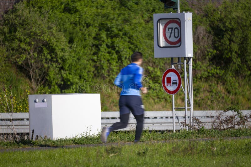 Jogger with Traffic Speed Control System, Germany Stock Image - Image ...