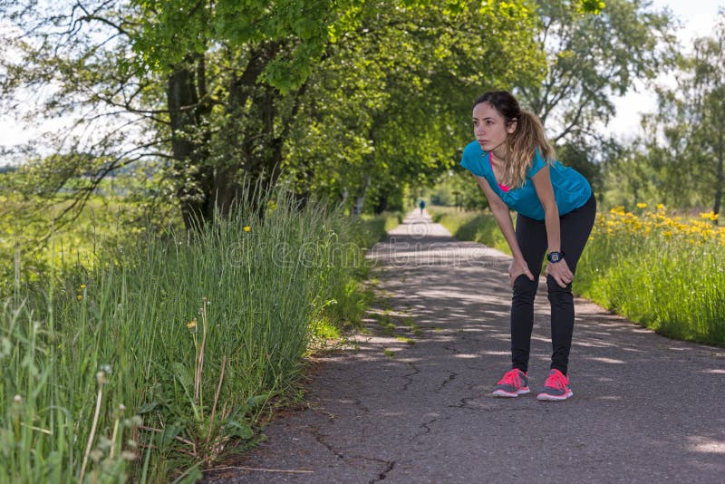 Jogger Woman during a Break Stock Image - Image of jogging, exercise ...