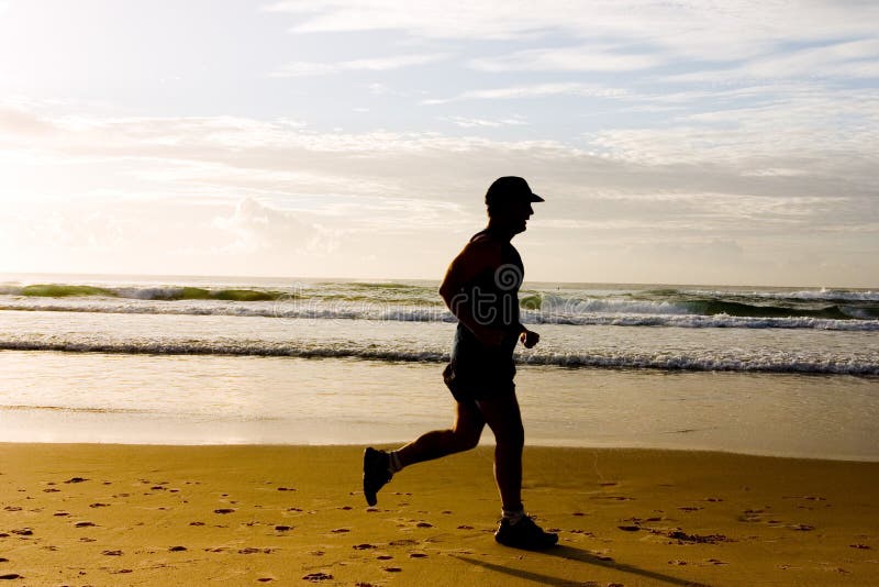 Jogging at the beach stock image. Image of lunging, strength - 163659
