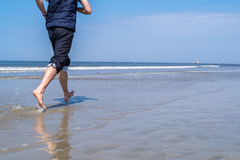 Jogging on the Beach North Sea Stock Photo - Image of jogging, fitness ...