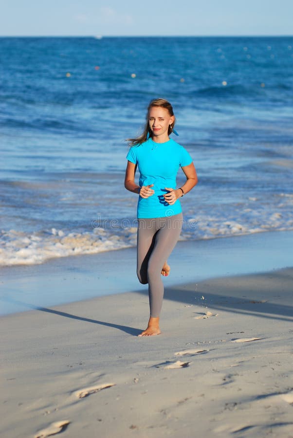 Jogging at beach stock image. Image of beach, outdoors - 8618125