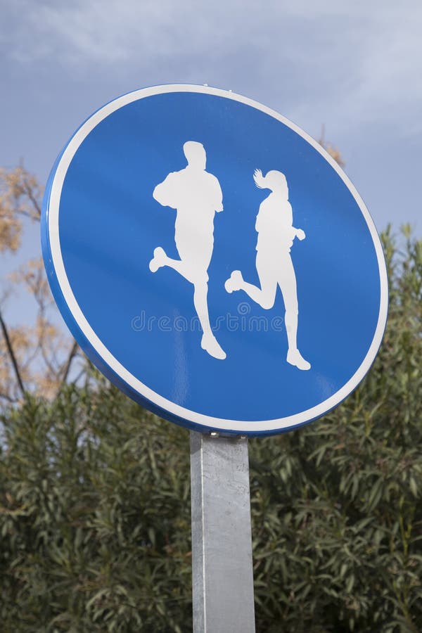 Jogging Sign stock photo. Image of summer, grass, blue - 83390096