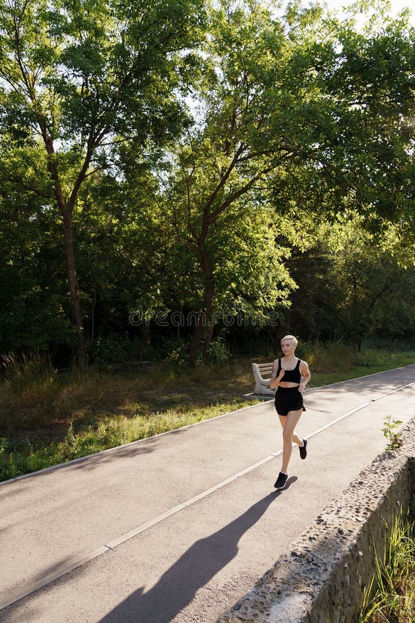Jogging into the Sun stock photo. Image of jogging, training - 306626514
