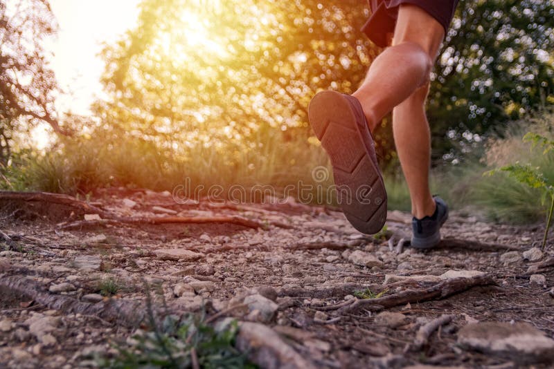 Man Legs Running on Trail in the Mountains Stock Photo - Image of ...
