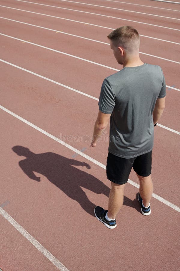 Jogging on Track with Shadow on Surface Stock Photo - Image of running ...