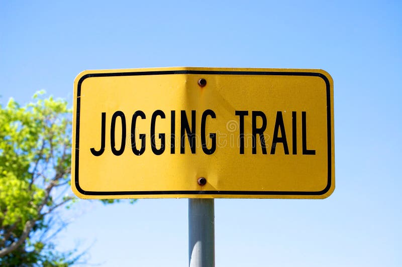 Jogging Trail Sign stock photo. Image of yellow, symbol - 24583952