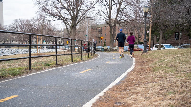 Jogging on a Winter Park Pathway Editorial Photo - Image of trees ...