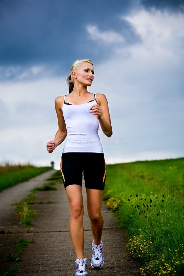 Young Woman Jogging on Street Stock Photo - Image of active, jogging ...
