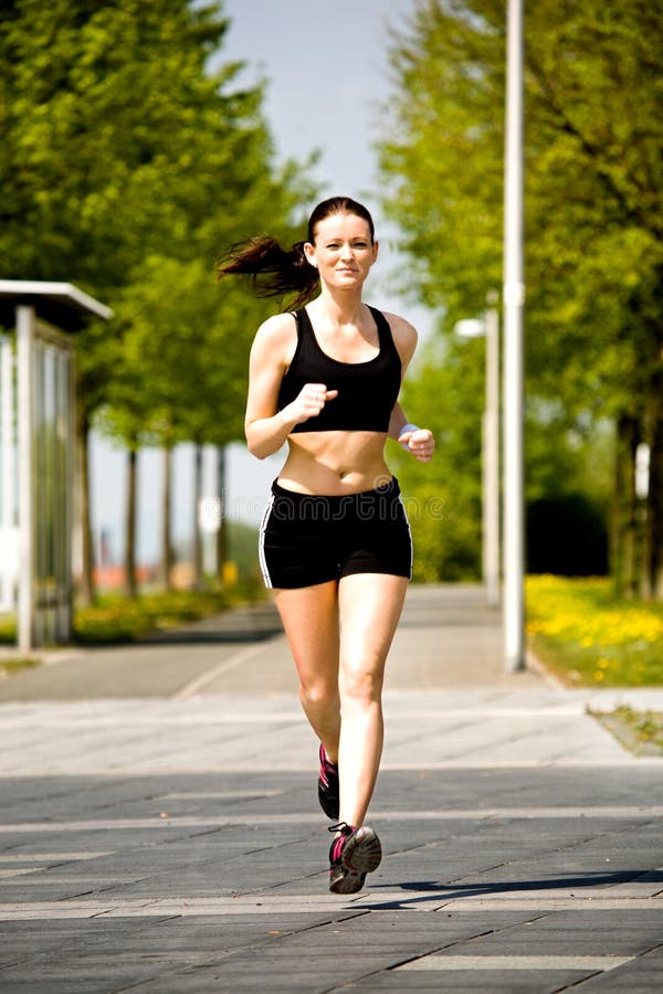 Jogging woman stock image. Image of sports, street, city - 19752533