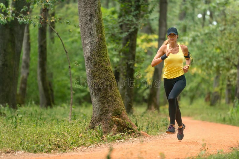 Running in forest stock photo. Image of young, flexibility - 223783698