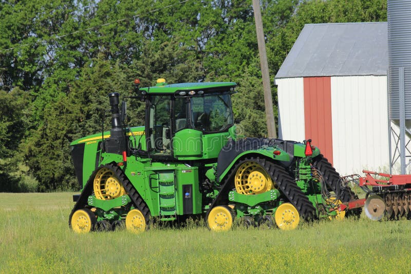 Johndeere Tractor with a Disc on the Back Shot Closeup in a Field ...