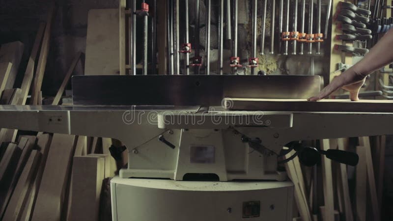Joiner Processing the Workpiece of Wooden Plank by Jointing Machine ...