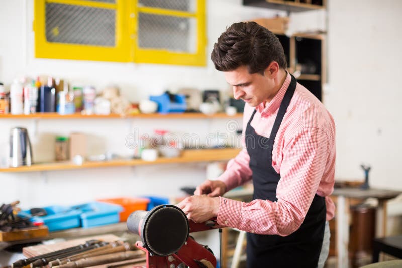 Joiner working on machine stock image. Image of business - 246611295
