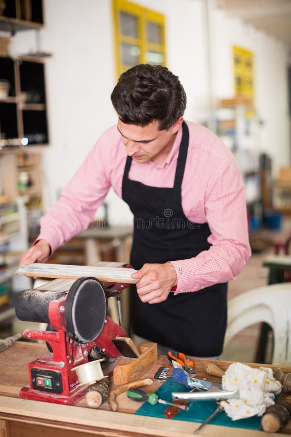 Joiner working on machine stock photo. Image of machine - 269303100