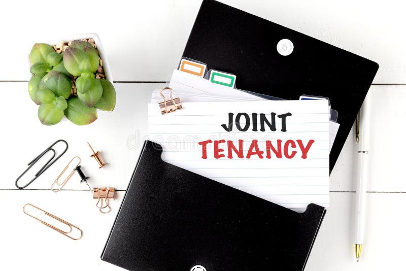 JOINT TENANCY Text on Note with Office Supplies Stock Image - Image of ...