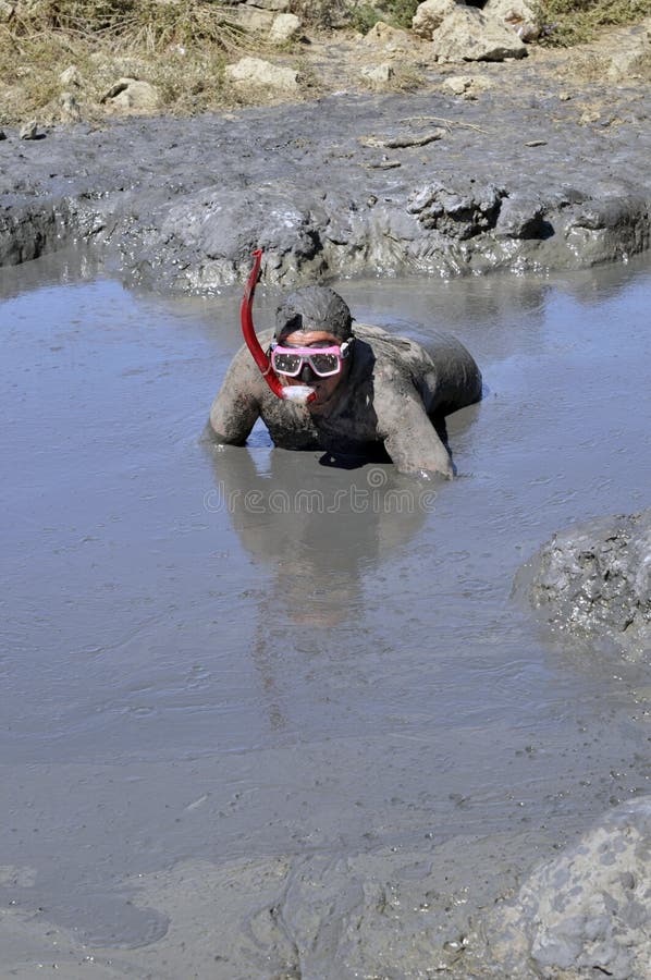 Woman fell into the mud editorial stock image. Image of female - 33090794