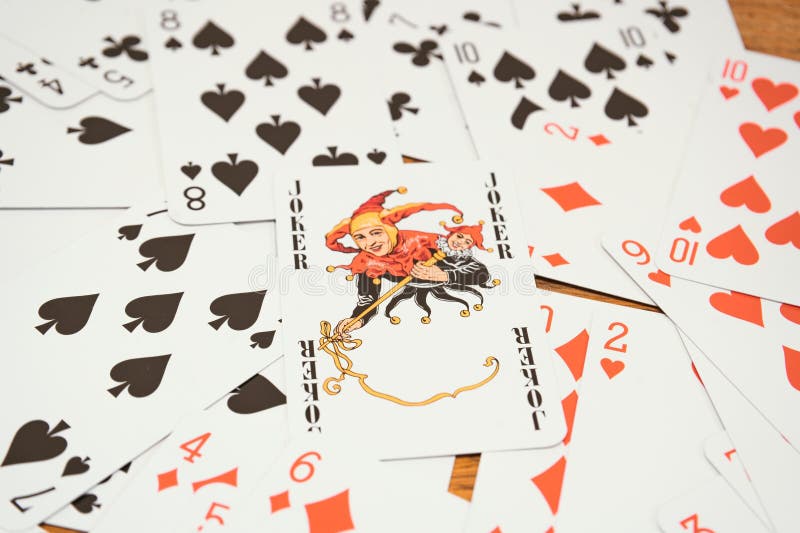 Joker Card among Scattered Playing Cards Stock Image - Image of casino ...