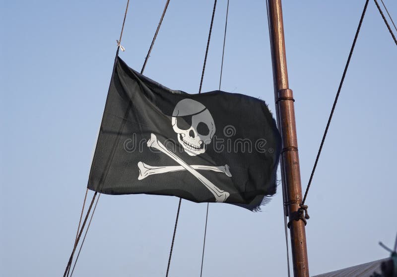 Jolly Roger Skull and Crossbones Flag Stock Photo - Image of ship ...