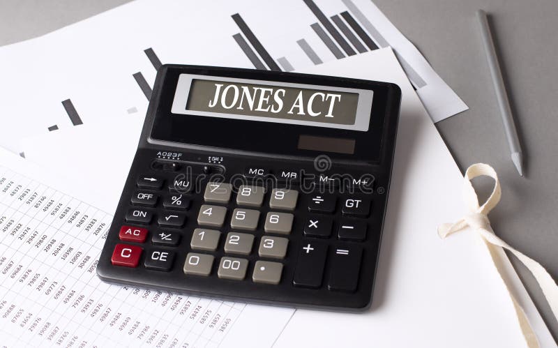 JONES ACT Text on Calculator with Chart on Grey Background Stock Image ...