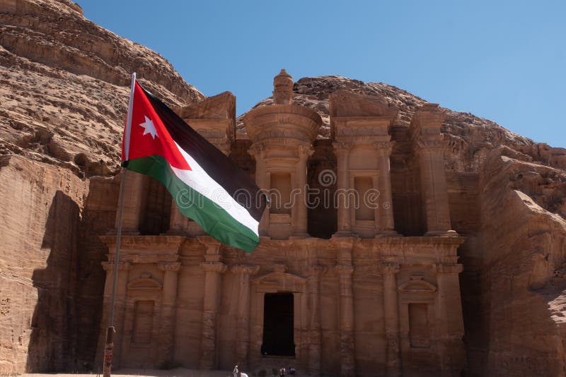 The Jordan flag in Petra stock photo. Image of building - 157381844