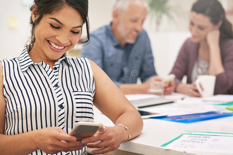 Jotting Down Some Notes from Her Meeting in Her Phone. a Young Woman ...