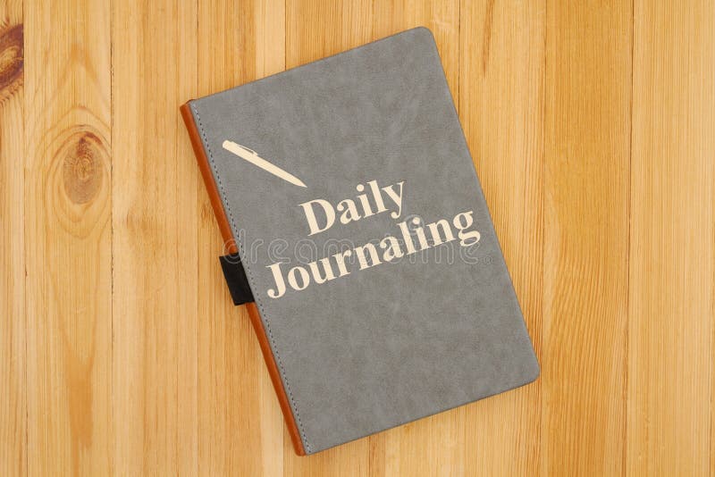 Daily Journaling Message Written on a Journal on a Desk Stock Photo ...