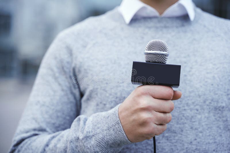 Male Hand with a Reporter Microphone. Journalist during His Work Stock ...
