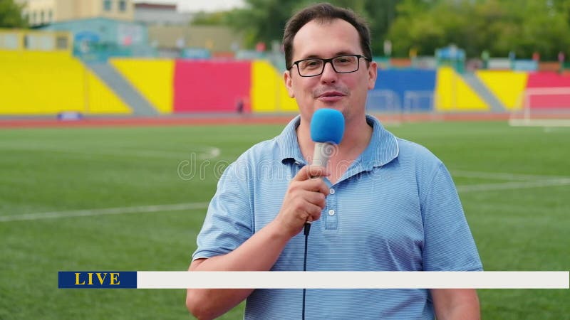 The Journalist is Reporting from the Stadium for Television with ...