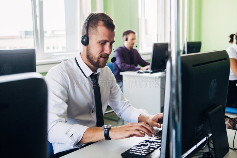 Joyful Agent Working in a Call Center with His Headset Stock Photo ...