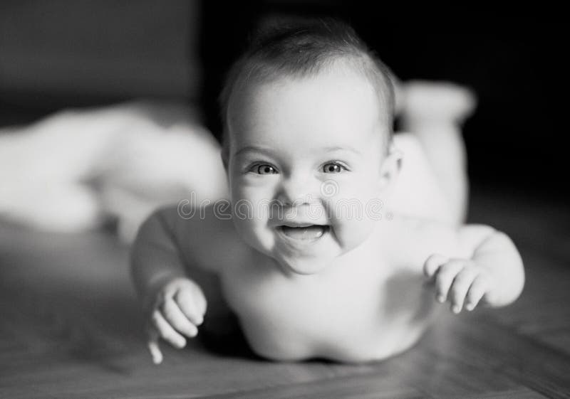 Joyful baby on the floor stock image. Image of hands - 38663401