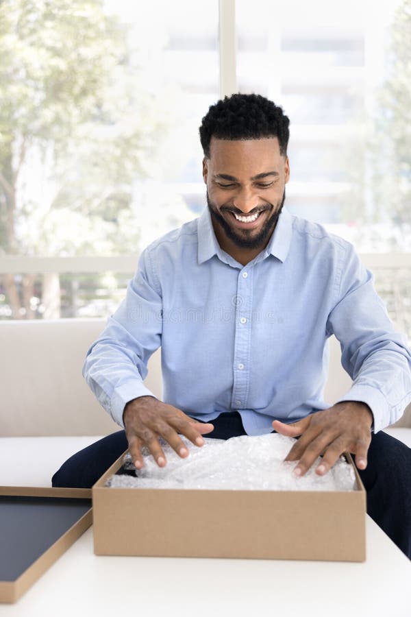 Joyful Black Client Man Getting Parcel from Transportation Logistic ...
