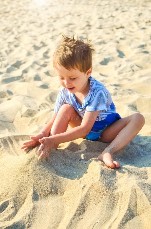 Joyful Boy Plays with Sand by the Sea Stock Image - Image of shovel ...