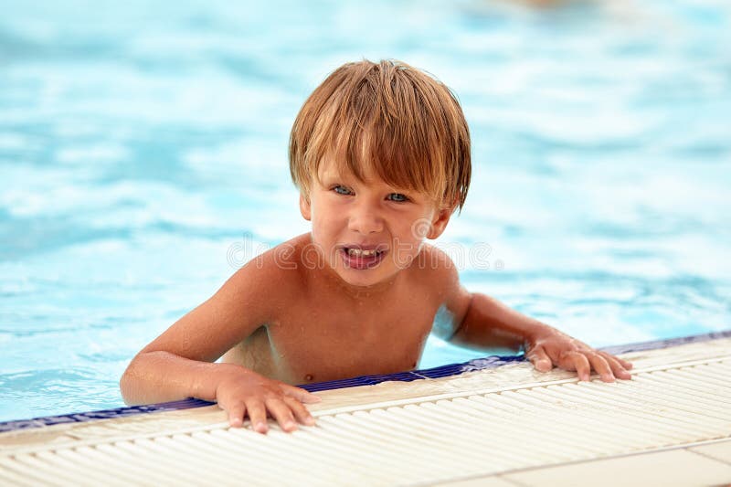 Joyful Boy in the Pool of the Water Park, the Kid Joyfully Poses for ...