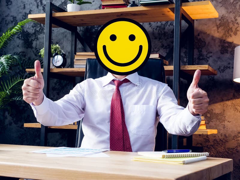 Joyful Businessman at the Table with a Smiley Face instead of a Head ...