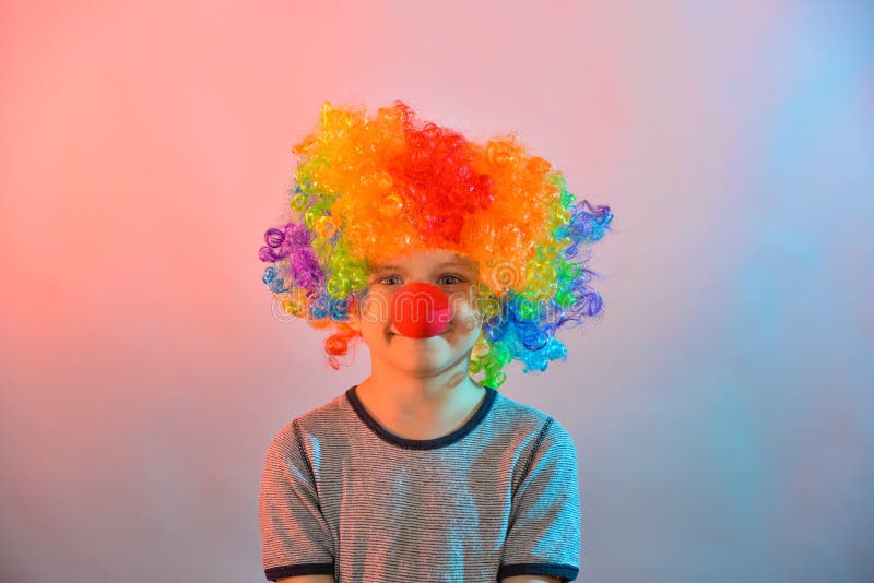 Joyful Child in a Clown Wig Looks at the Camera Stock Photo - Image of ...