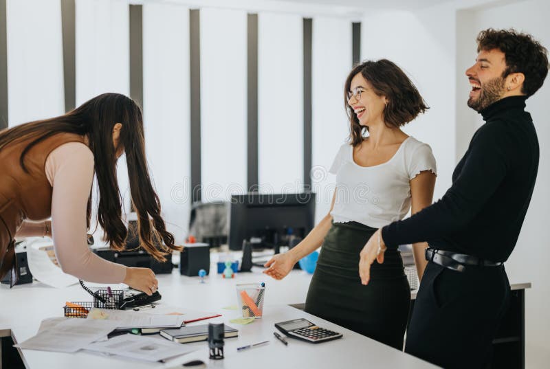 Joyful Colleagues Laughing and Enjoying Teamwork in a Bright Modern ...