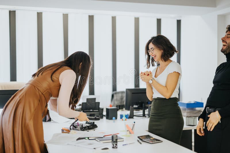 Joyful Colleagues Laughing and Interacting in a Modern Office ...