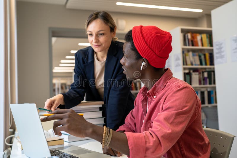 Couple Multiethnic Pleased Students Working As Team on Research Project ...
