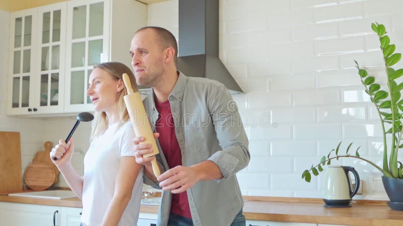 The Joyful Couple Have Fun Dancing and Singing in the Kitchen Stock ...