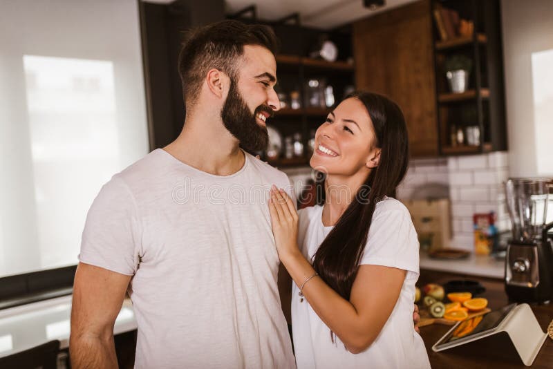 Couple Hugging in the Kitchen at Home in the Morning Stock Image ...