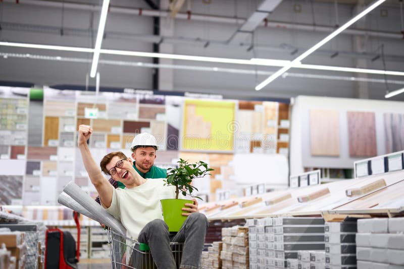 Joyful Customer and Warehouse Worker Have Fun in the Store Stock Photo ...