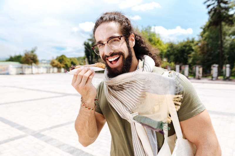 Joyful Delighted Man Holding an Eclair Stock Photo - Image of relax ...